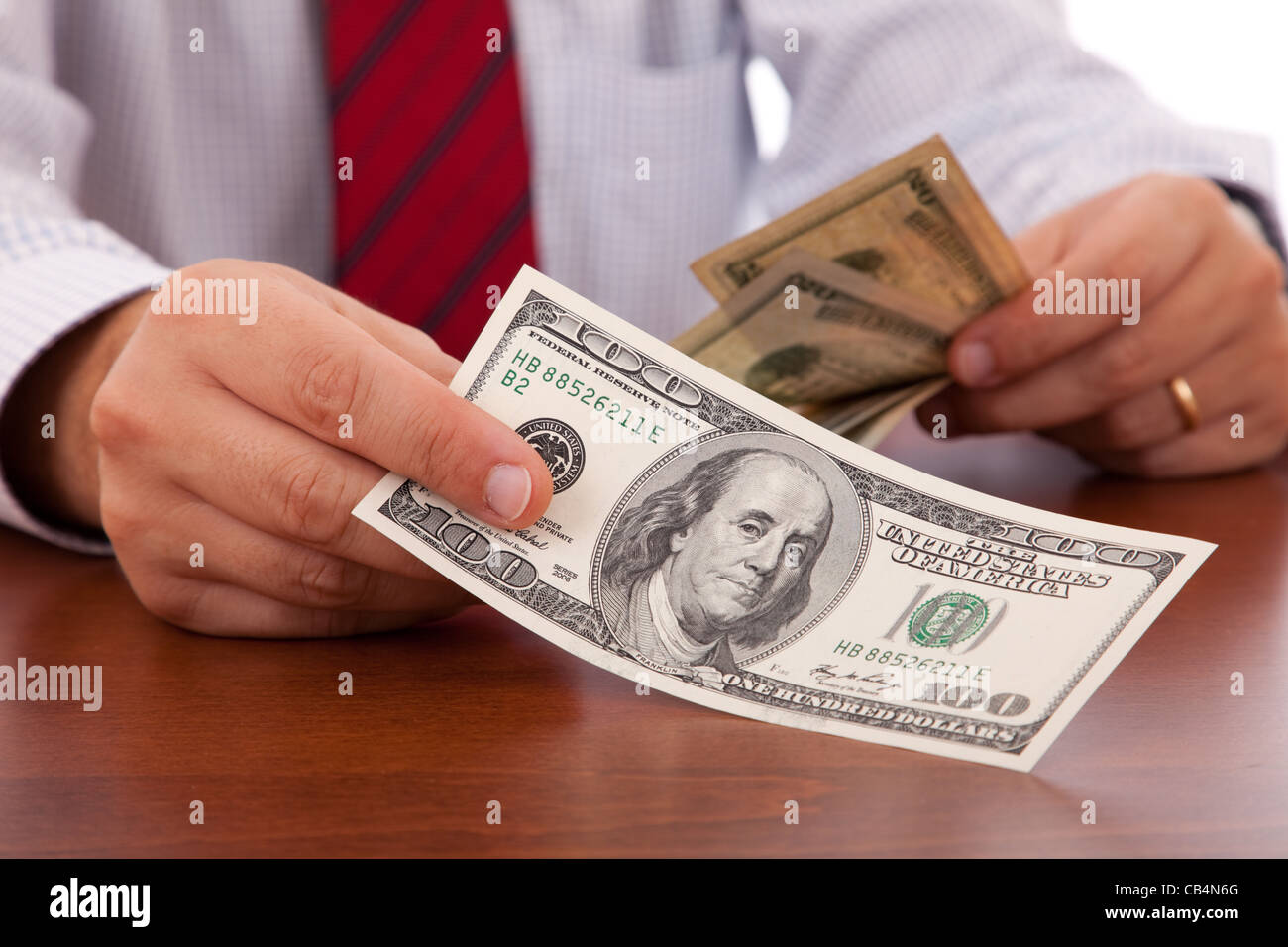businessman at the office giving money Stock Photo - Alamy