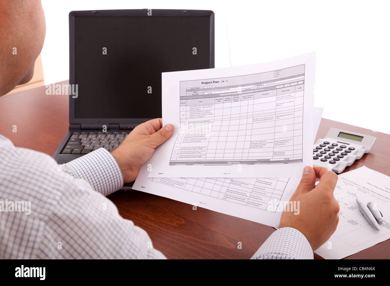 businessman reviewing the project at his office Stock Photo - Alamy