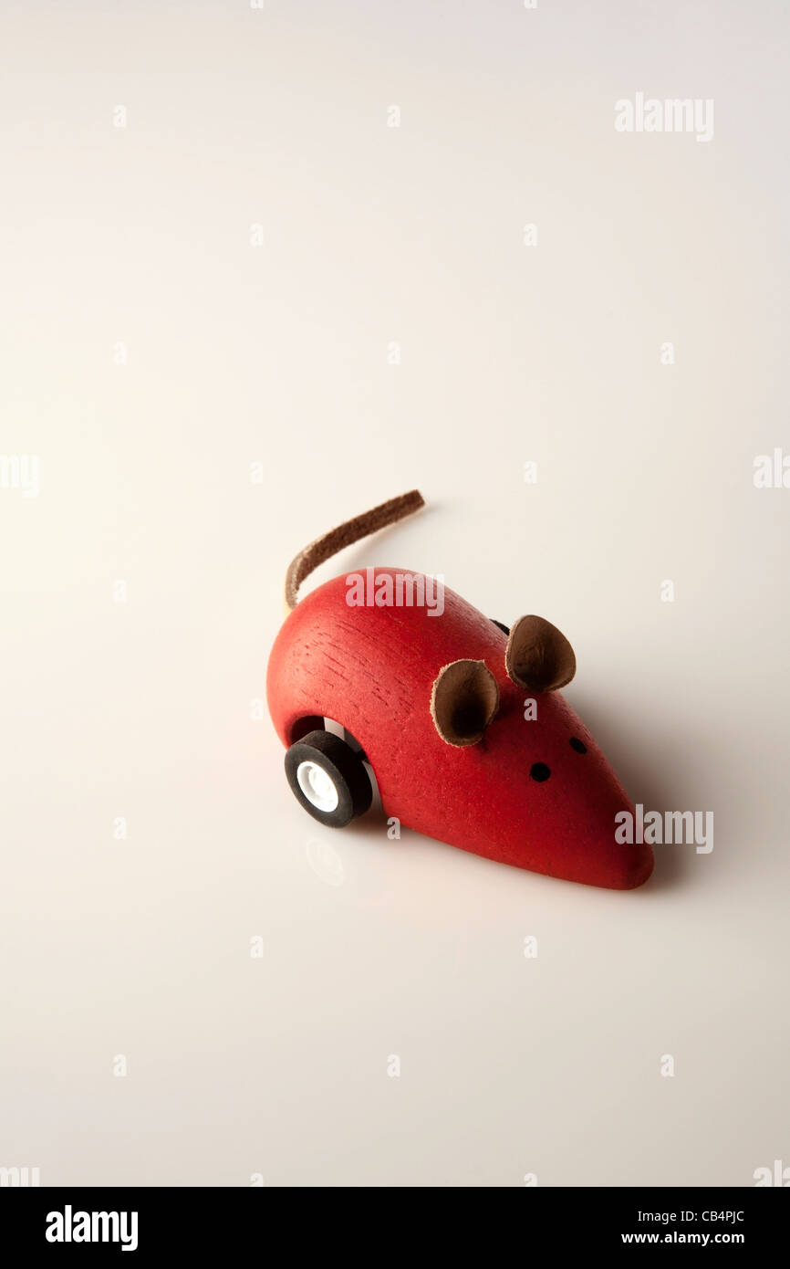 red toy mouse with wheels on white background Stock Photo - Alamy