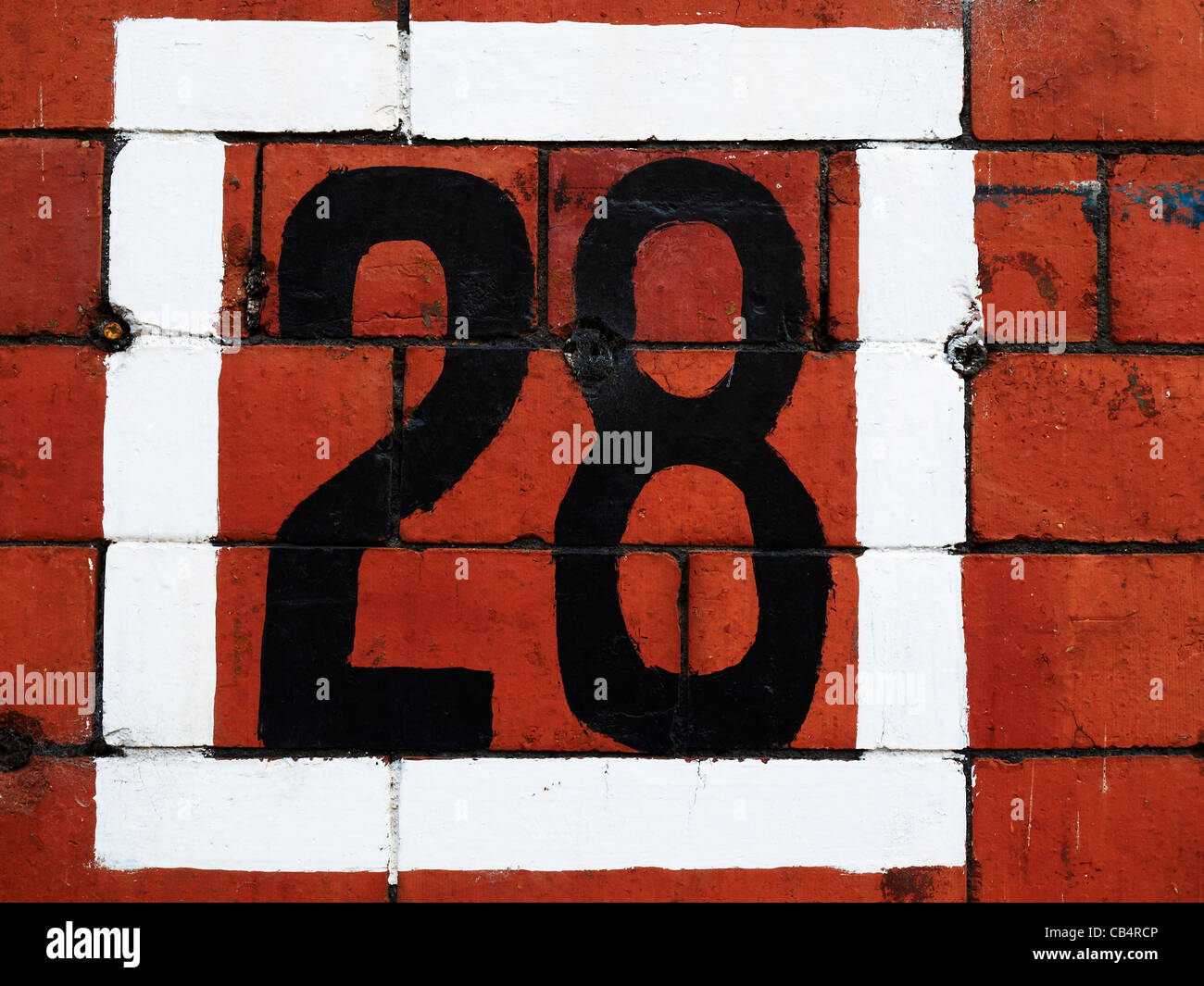 House number 28 painted on outside wall Stock Photo - Alamy