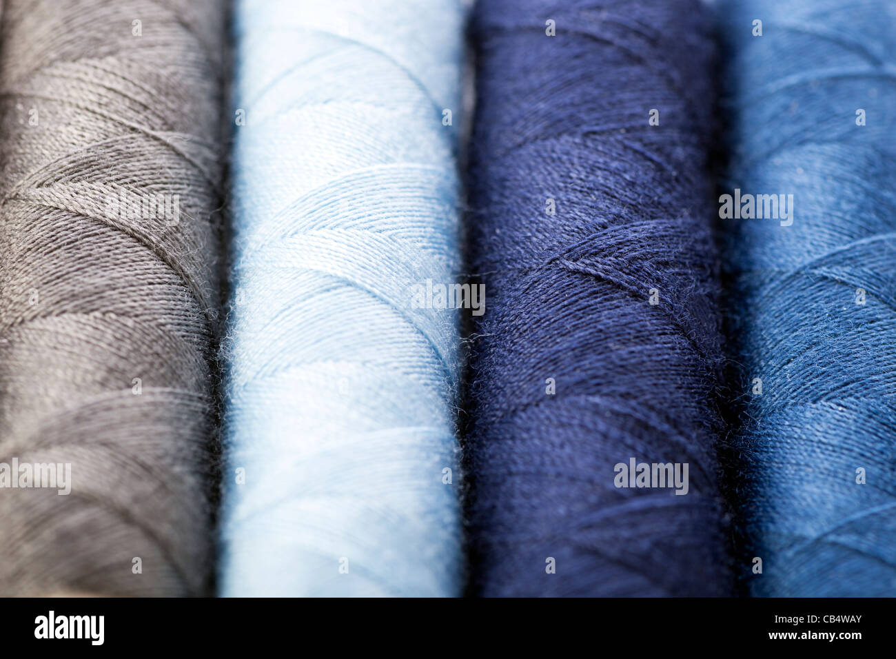 Cotton threads in shades of blue and gray Stock Photo - Alamy