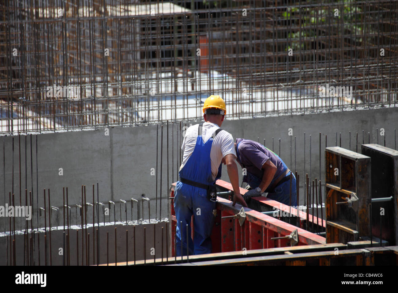 construction site with worker working planks metal wall Stock Photo - Alamy