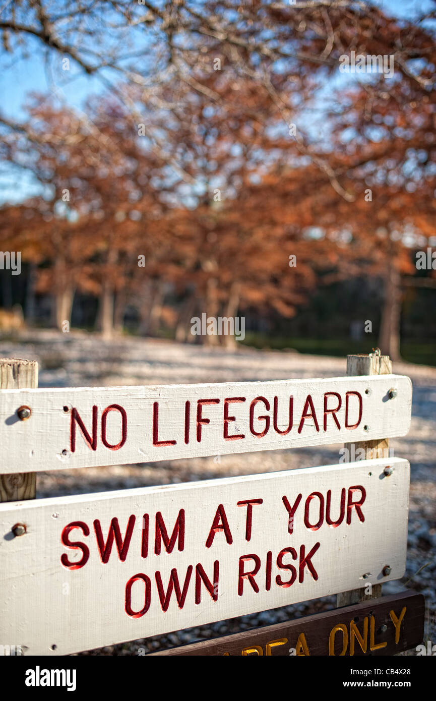 Sign: No Lifeguard - Swim at your own risk Stock Photo - Alamy