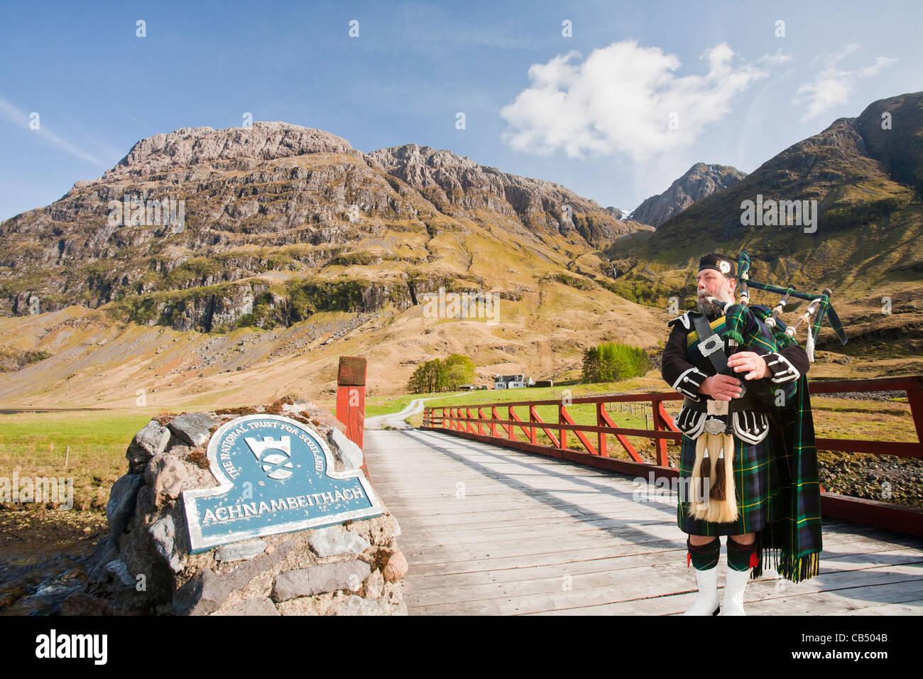 A bridge crossing the River Coe in Glen Coe, looking up to the summit ...