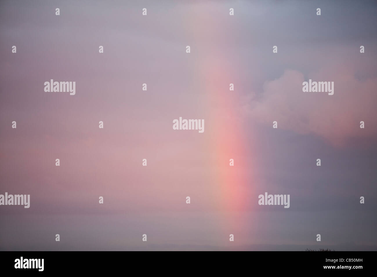 A rainbow at sunset Stock Photo - Alamy