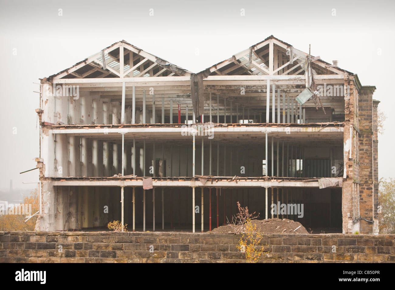 An old cotton mill building being demolished in Burnley, Lancashire, UK ...