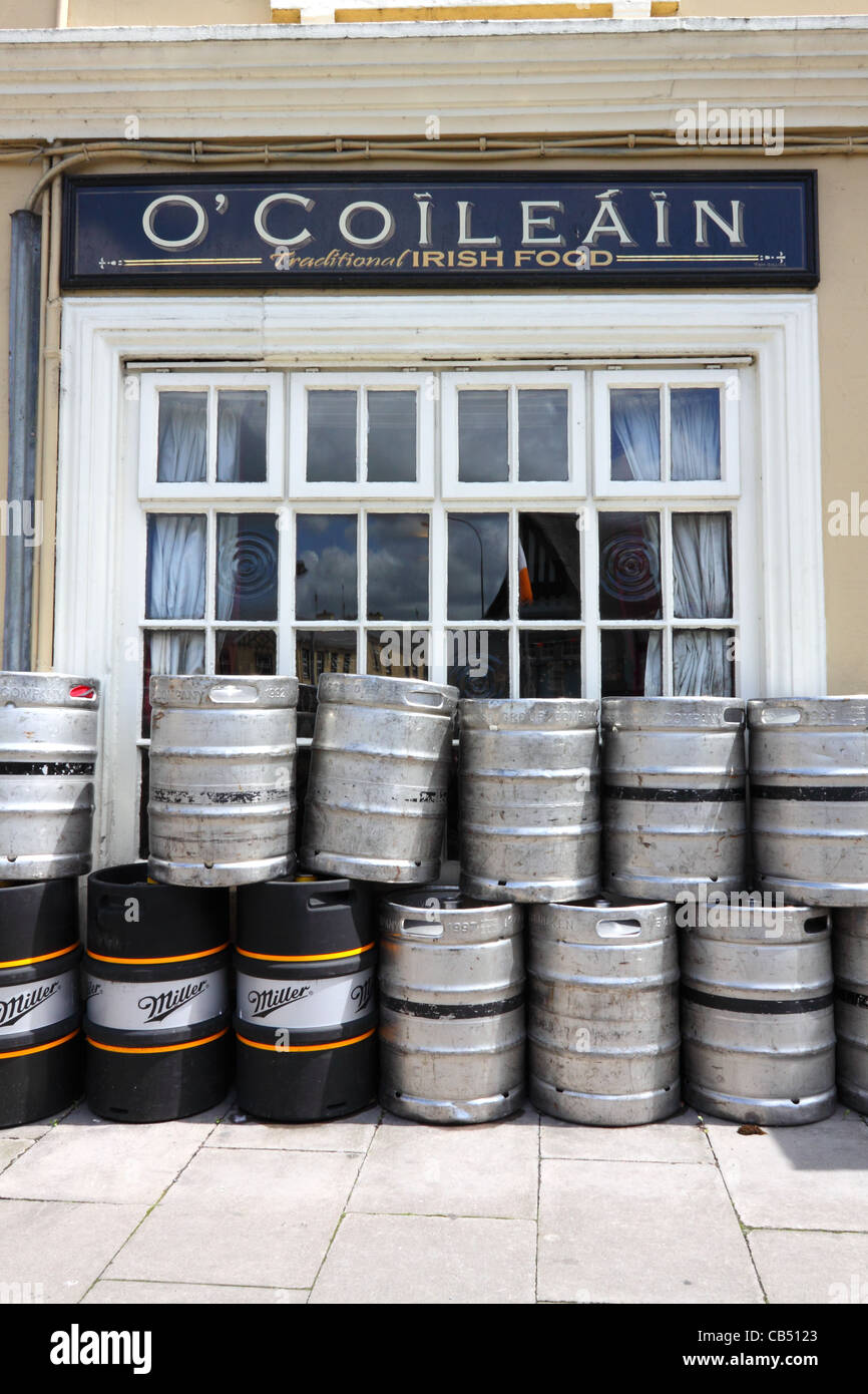 beer kegs stacked outside a pub in Adare, County Limerick, Ireland ...