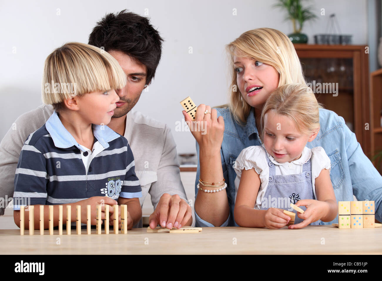 Family playing dominoes Stock Photo - Alamy