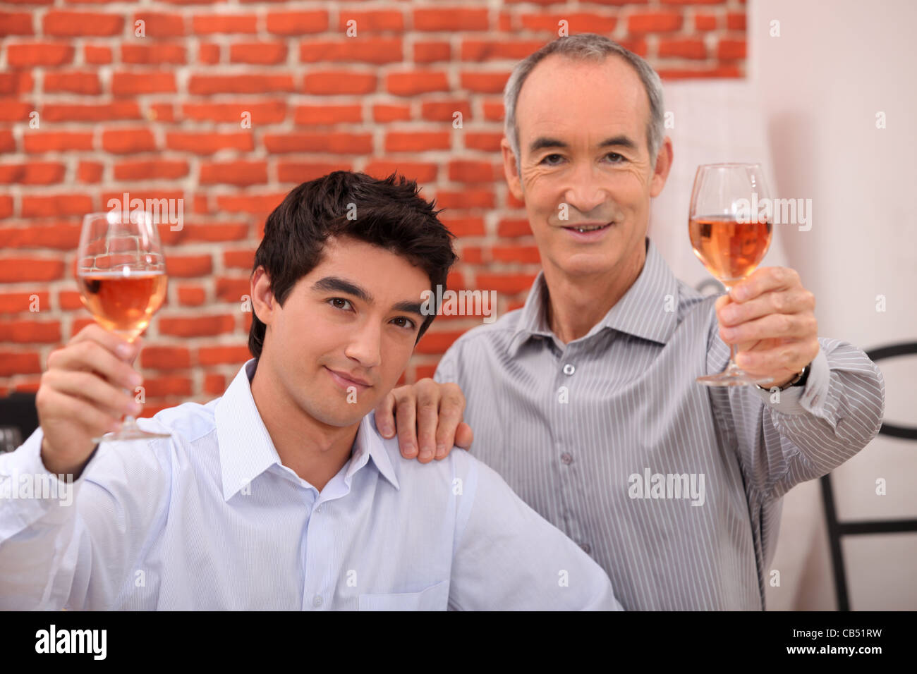 Two men drinking rose Stock Photo - Alamy