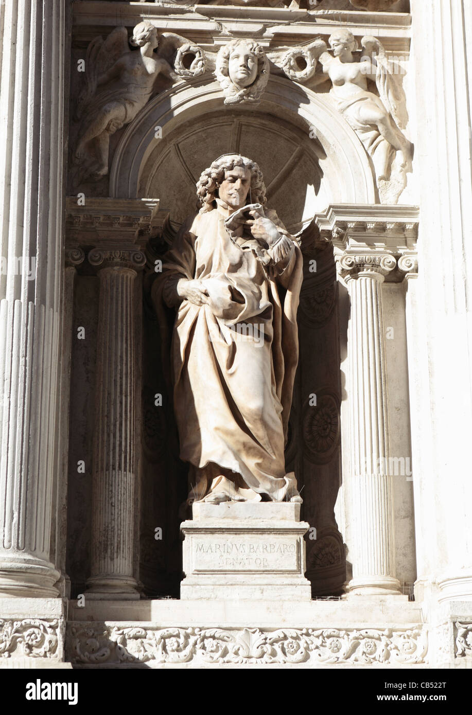 A statue of a member of the Barbaro family on the outside of Chiesa di ...