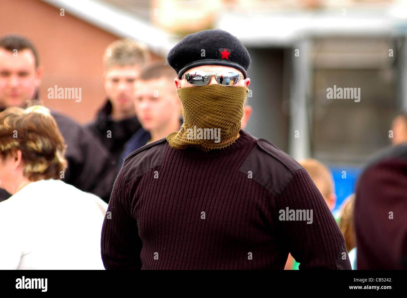 Masked member of the Irish Nationalist Liberation Army (INLA) attending ...