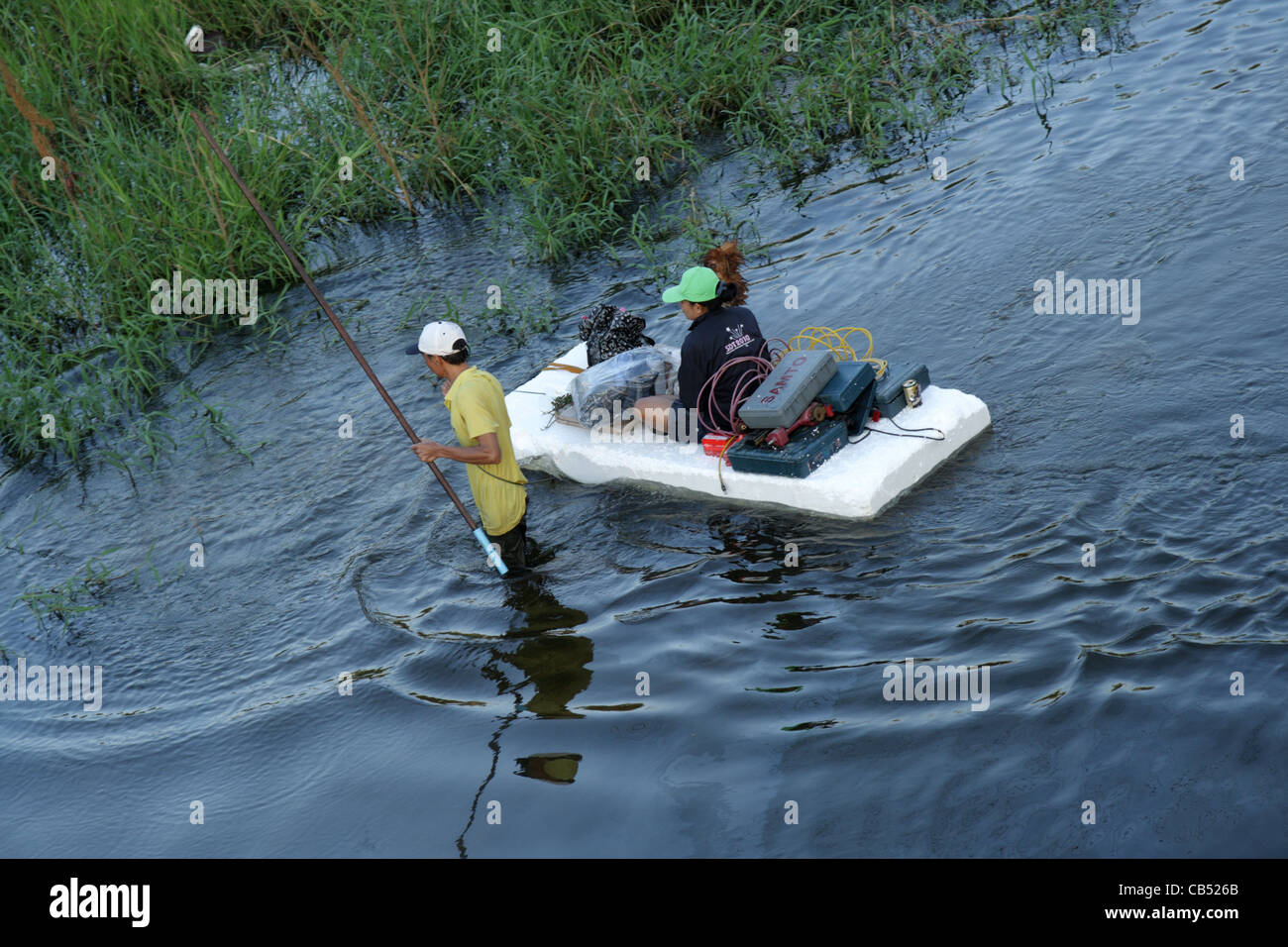 People wading in floodwaters at Pakkred , Nonthaburi province ...