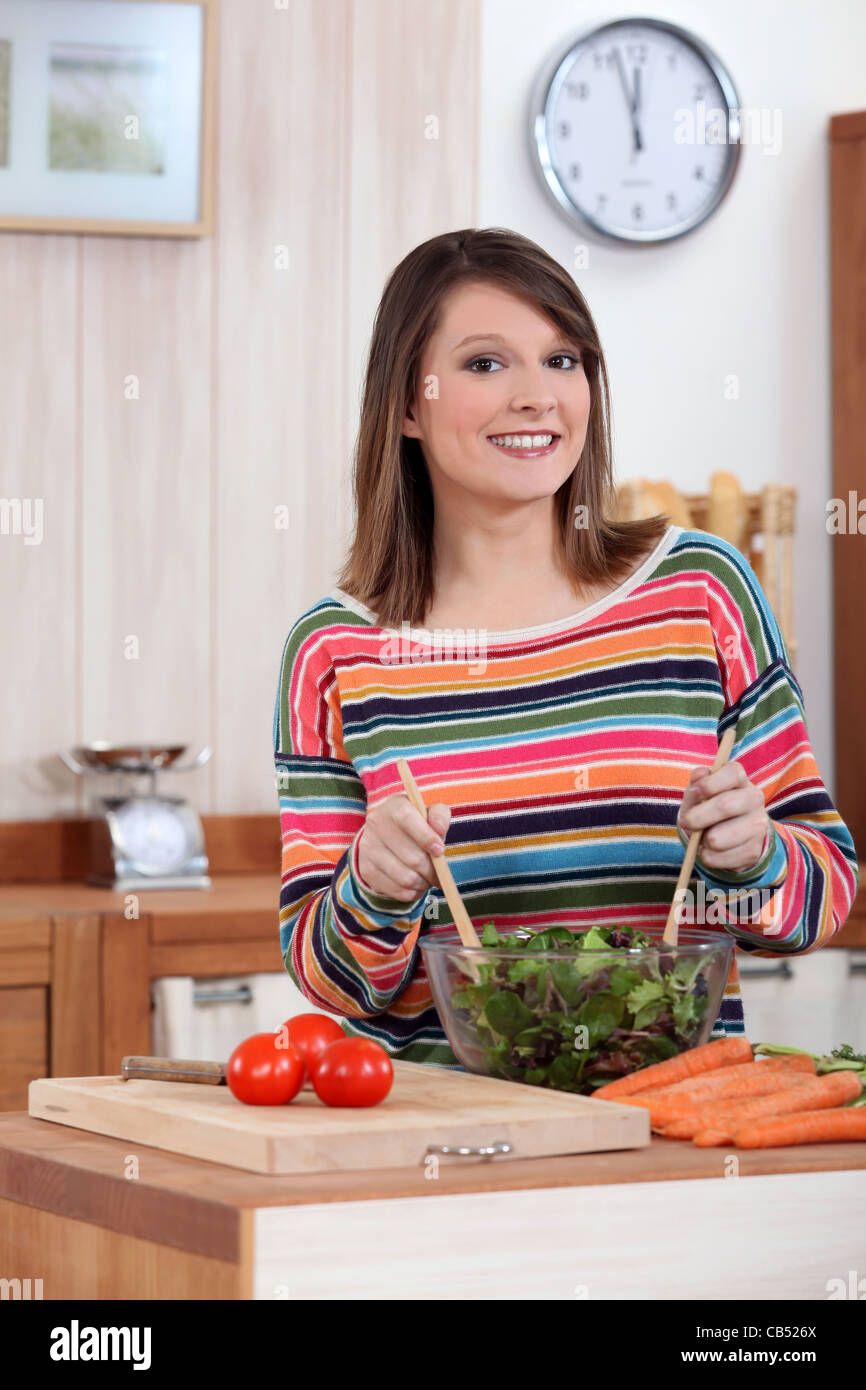 young woman making salad Stock Photo - Alamy