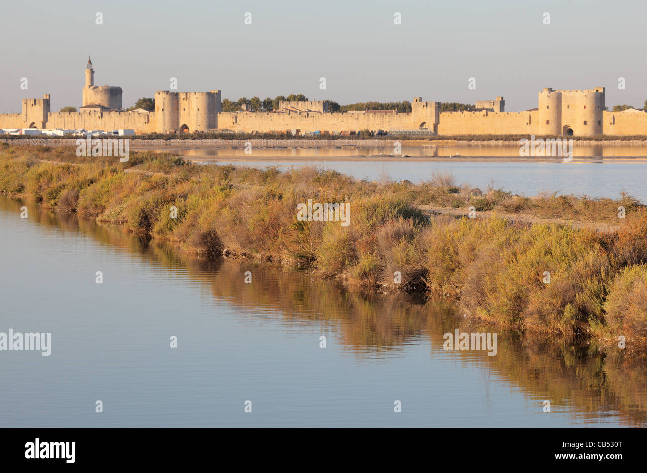 Medieval town Aigues-Mortes between swamps of the Camargue, France ...