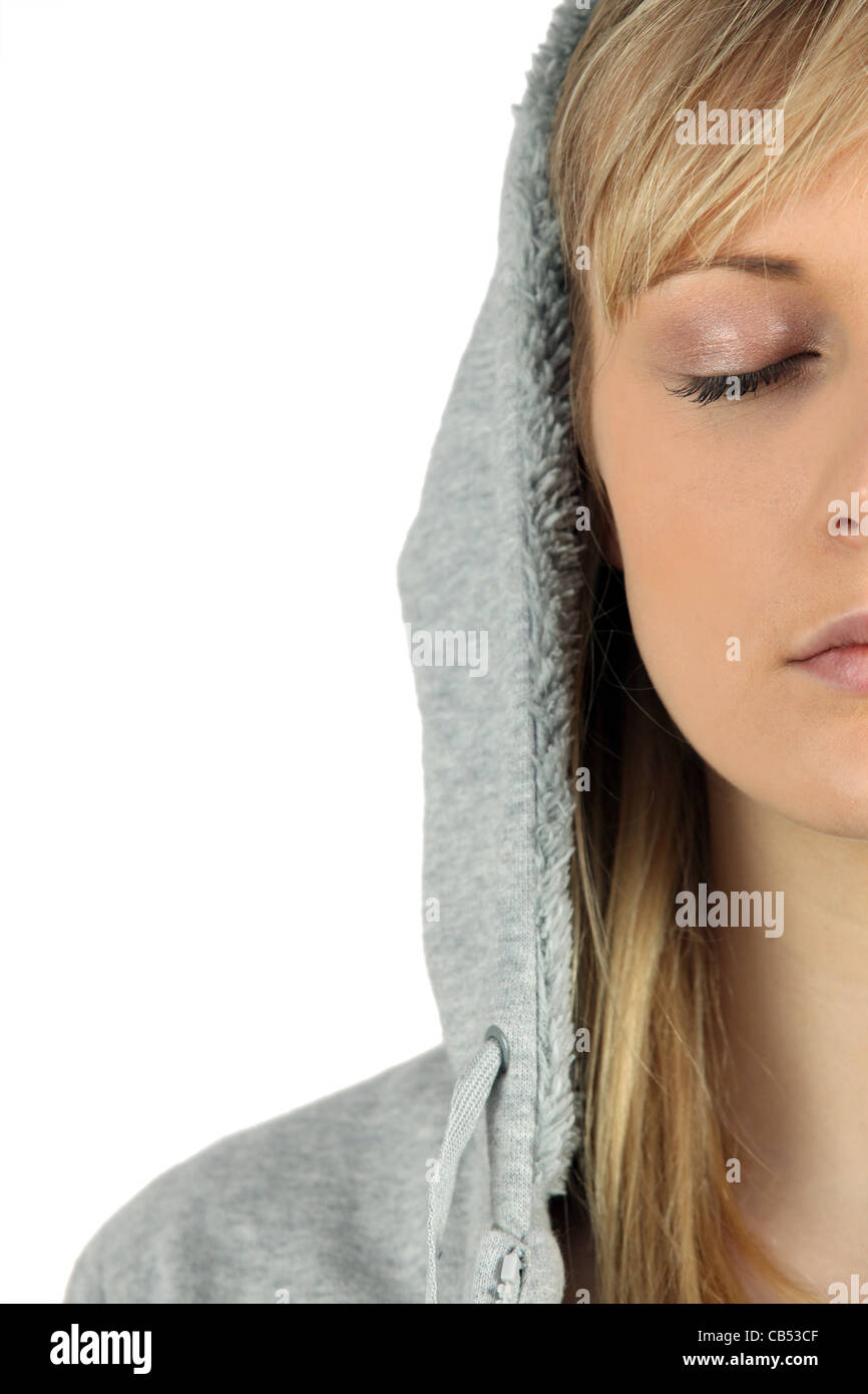 Attractive young blond wearing hood Stock Photo - Alamy