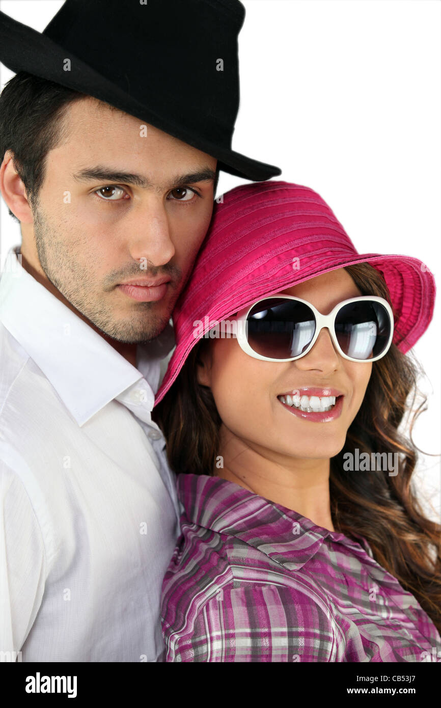 Couple wearing funny hats Stock Photo - Alamy