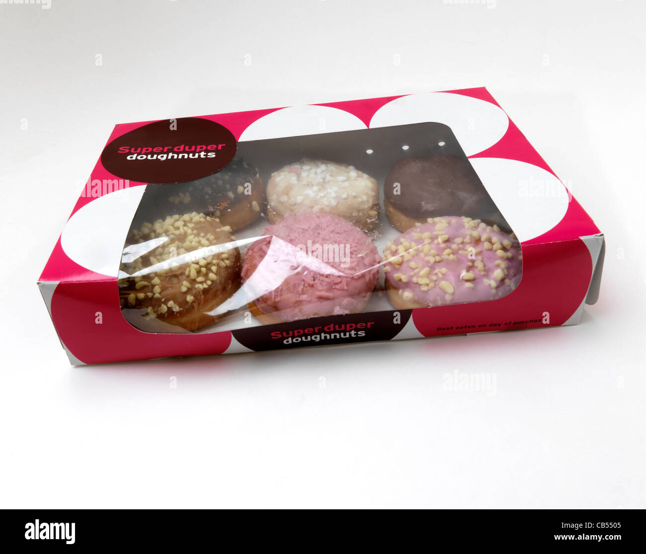 A Selection Of Doughnuts in A Box Pink, Chocolate, Toffee And White ...