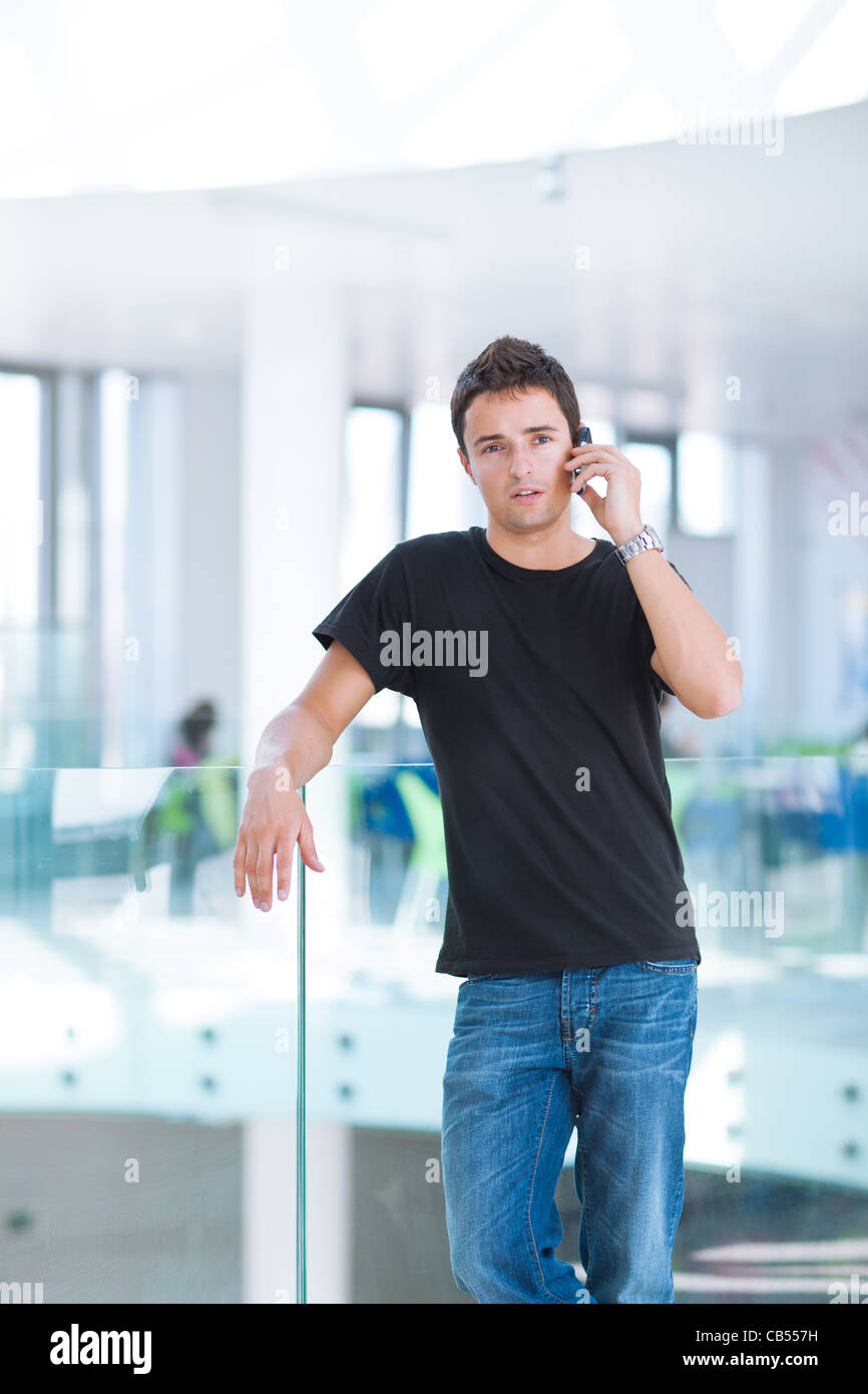 Handsome young man using his mobile phone/speaking on the phone Stock ...