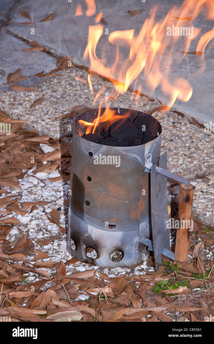 Chimney starter with burning coals for Dutch Oven outdoor cookout. Used ...