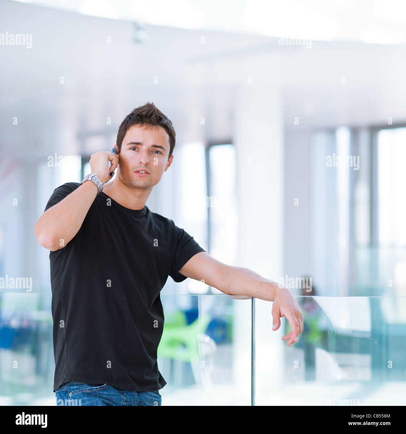 Handsome young man using his mobile phone/speaking on the phone Stock ...
