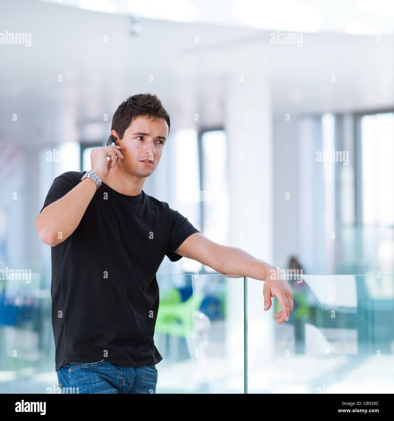 Handsome young man using his mobile phone/speaking on the phone Stock ...
