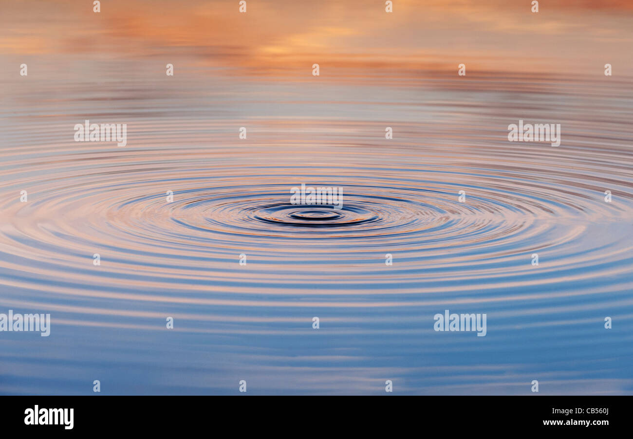 Golden water ripple at sunrise in India Stock Photo - Alamy