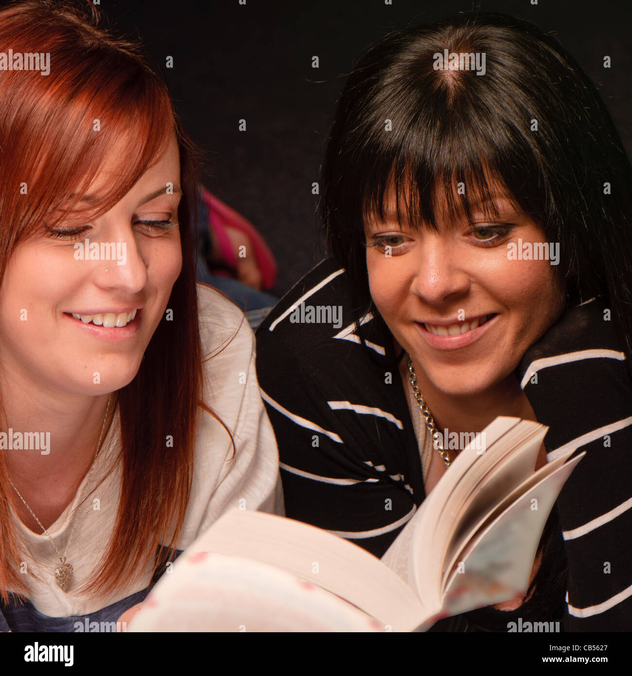 Young lady reading a book Stock Photo - Alamy