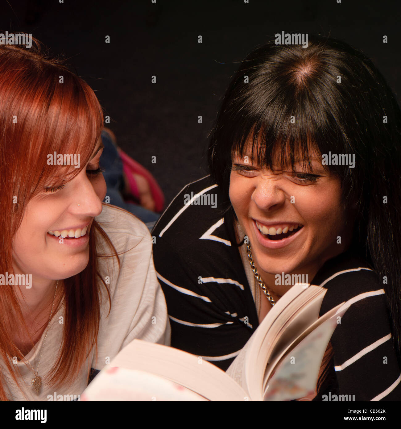 Young lady reading a book Stock Photo - Alamy