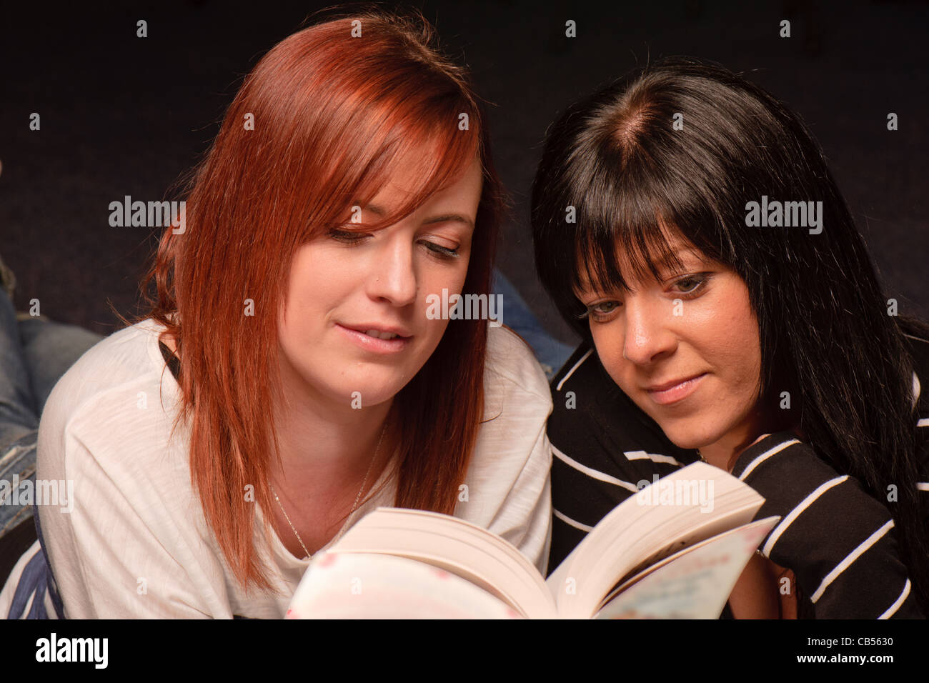 Young lady reading a book Stock Photo - Alamy