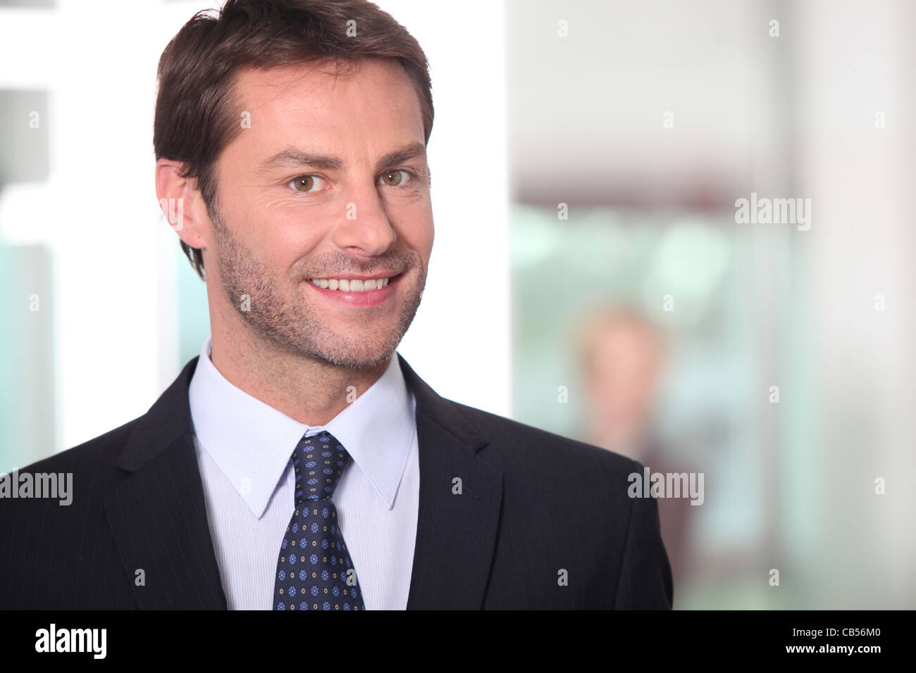 Portrait of a smiling banker Stock Photo - Alamy