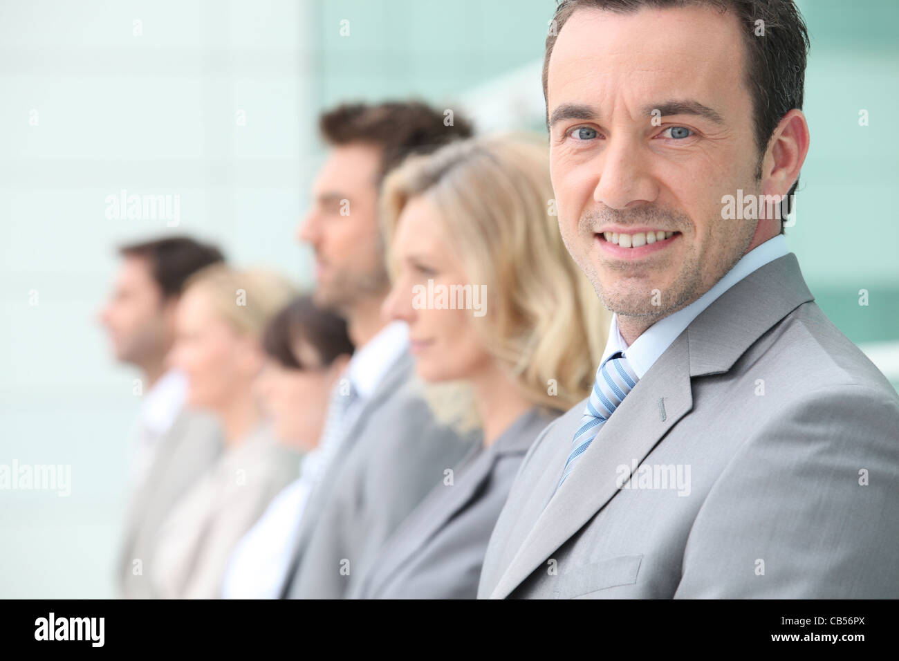 Business people lined up Stock Photo - Alamy