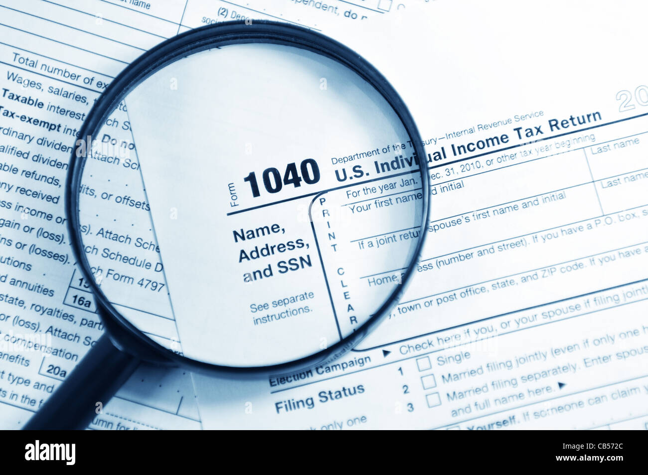 Tax papers with magnifying glass hi-res stock photography and images ...