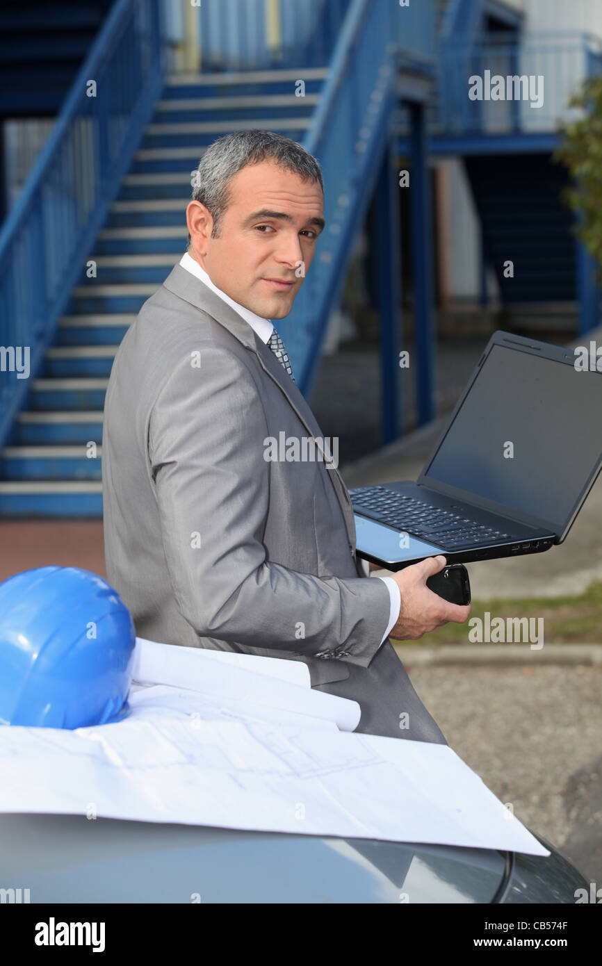 Architect with a laptop computer Stock Photo - Alamy
