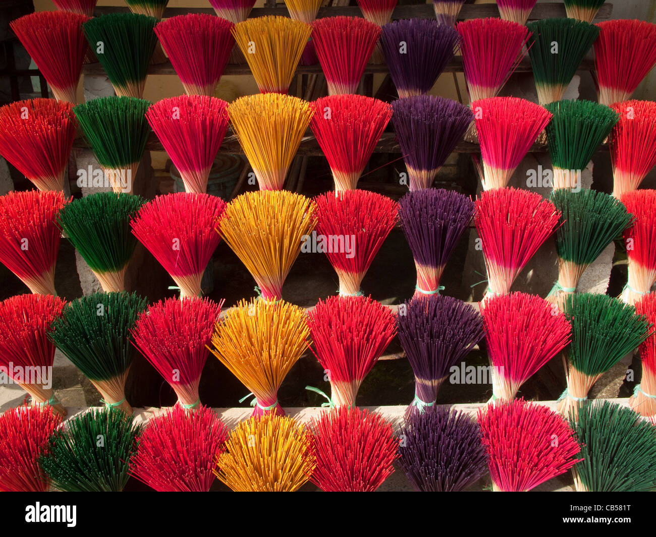 Colourful incense sticks bundled and displayed in a shop, Vietnam Stock ...