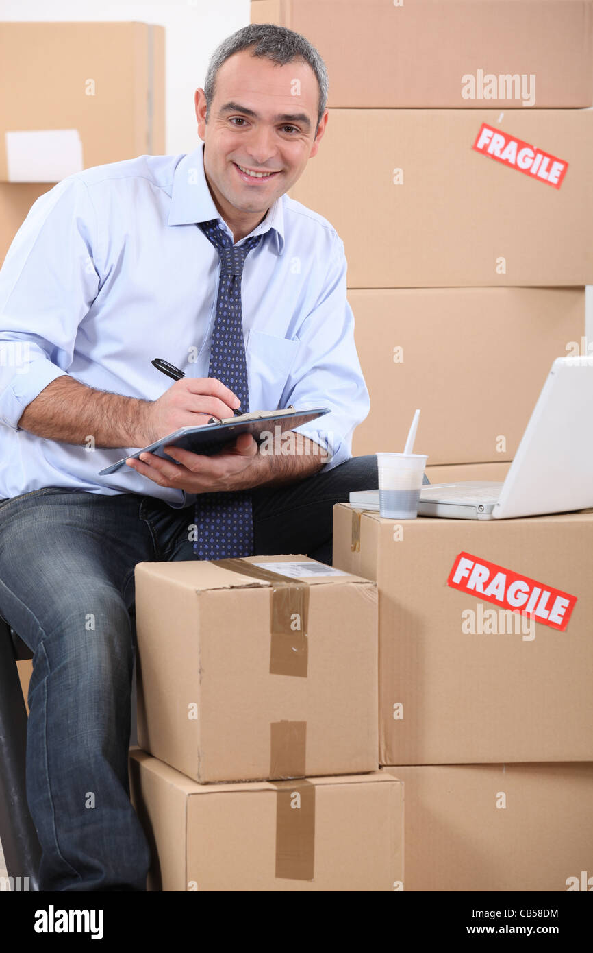 Man organizing a move Stock Photo - Alamy