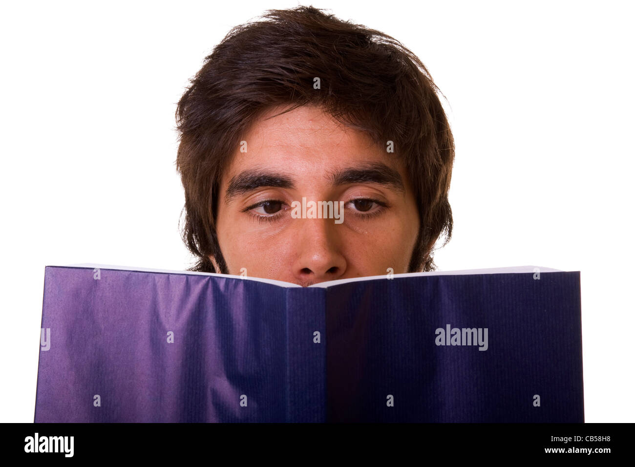 a young man reading a blue book (isolated on white Stock Photo - Alamy