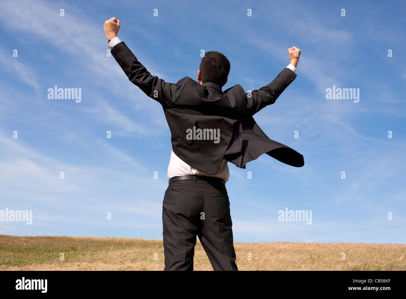businessman showing his success at the field Stock Photo - Alamy