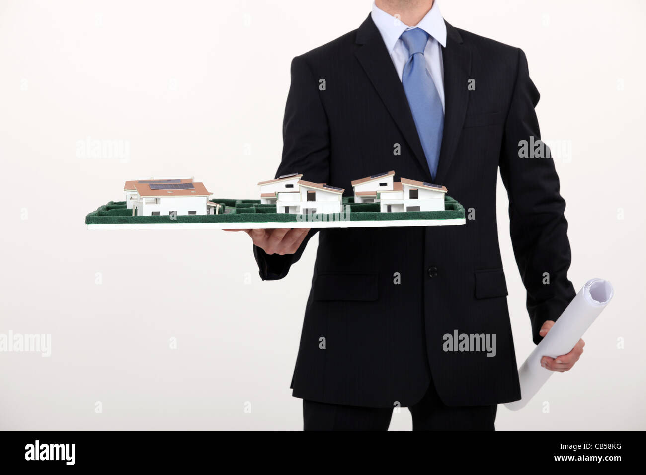 Architect holding scale model of housing Stock Photo - Alamy