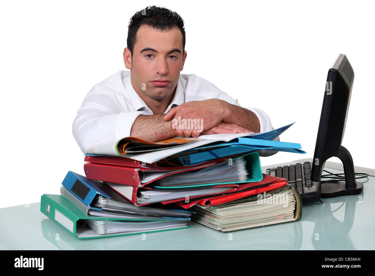 An overworked office worker Stock Photo - Alamy