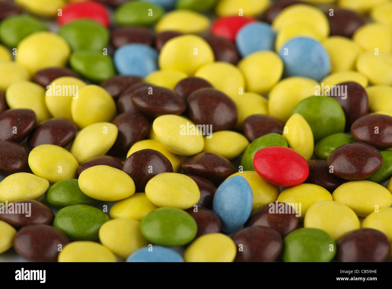 Many colourful halloween candy filling background Stock Photo - Alamy