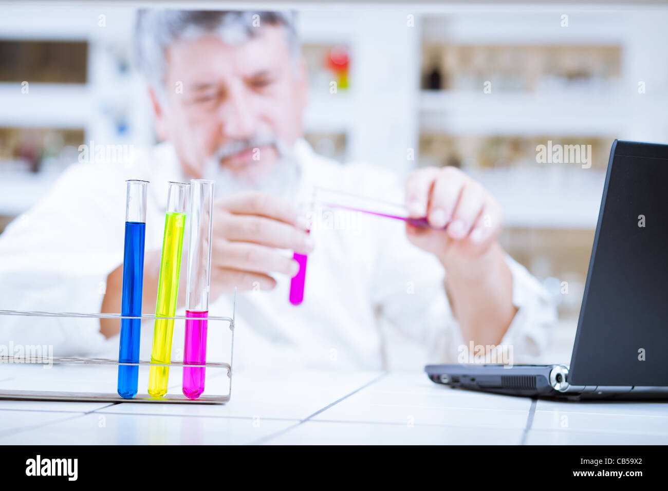 senior male researcher carrying out scientific research in a lab ...