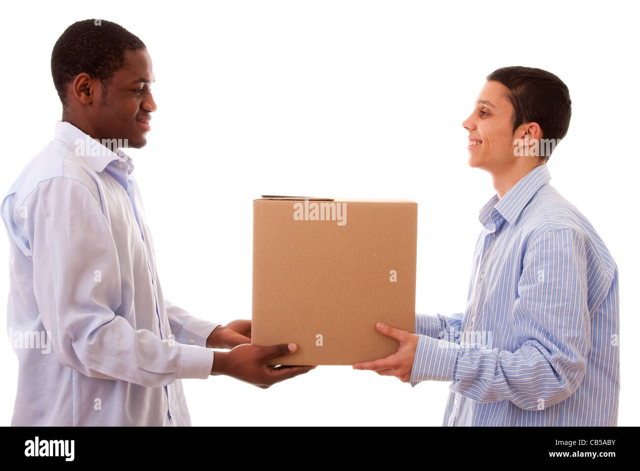 african and caucasian men holding cardboard box Stock Photo - Alamy
