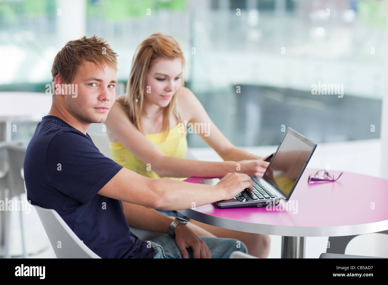 two college students studying together, using a laptop computer Stock ...