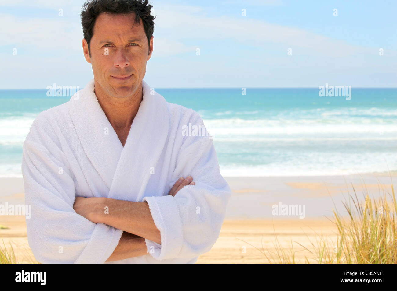 Man on the beach in bath robes Stock Photo - Alamy