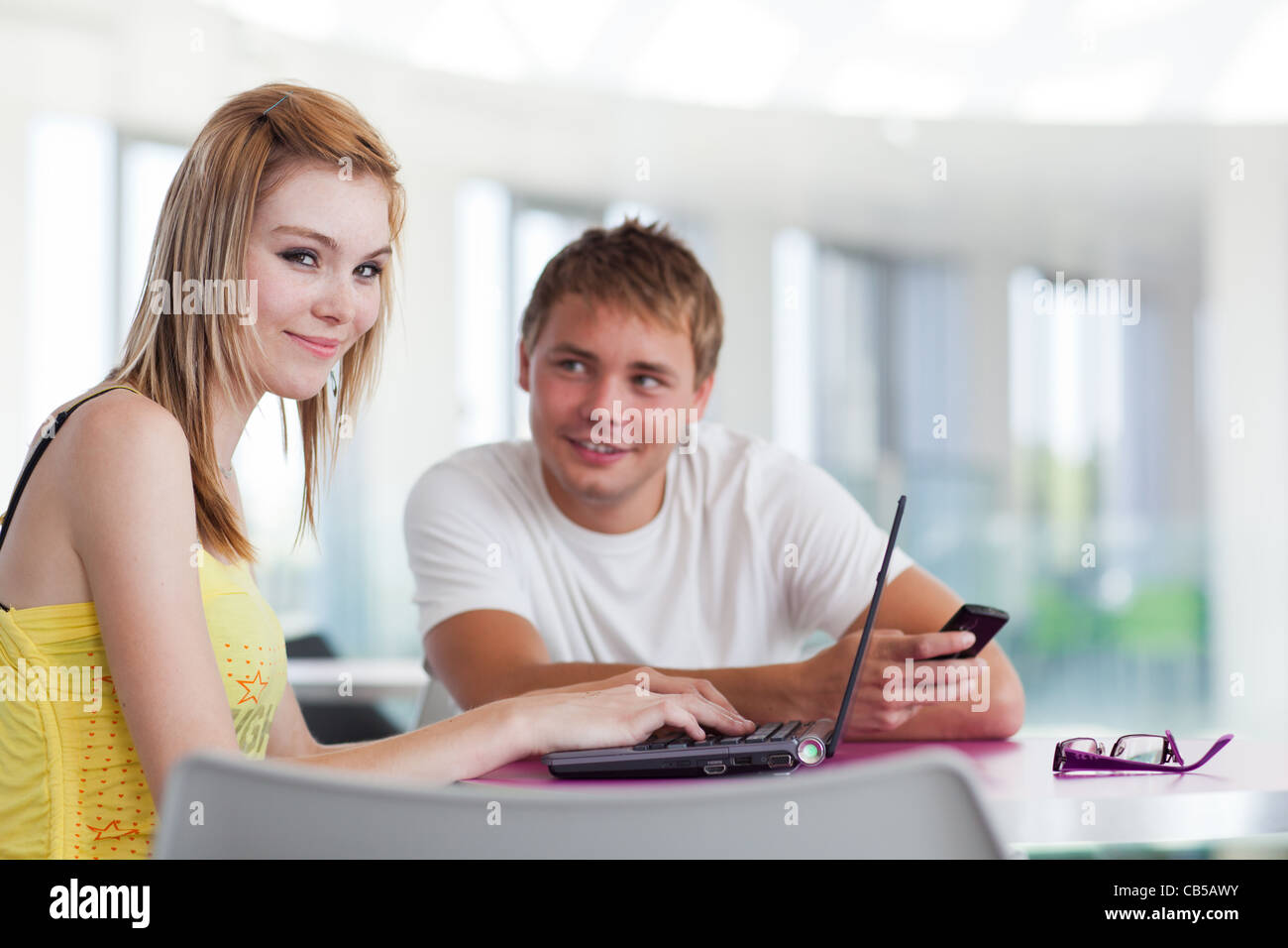 two college students studying together, using a laptop computer Stock ...