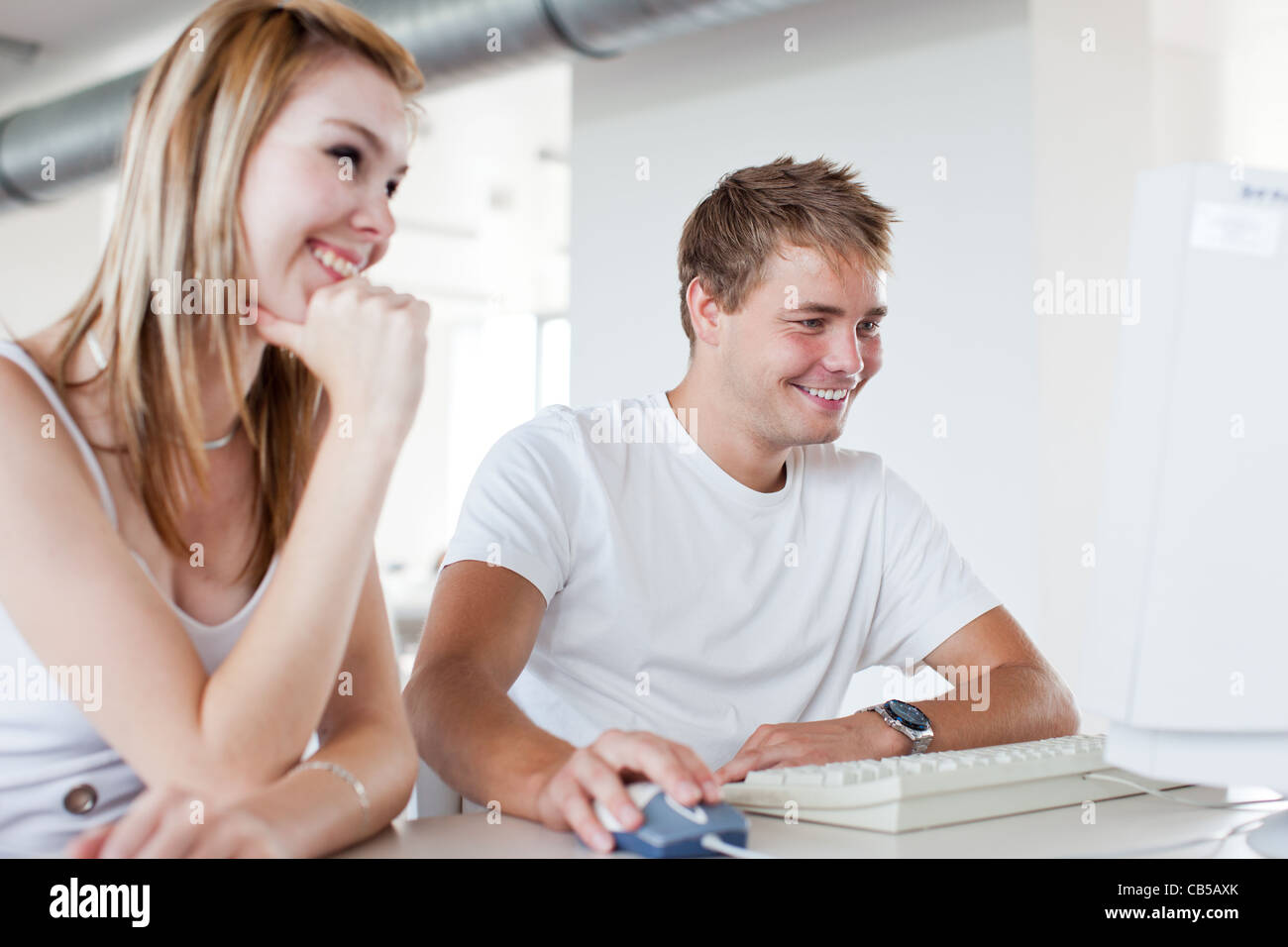 two college students studying together, using a laptop computer Stock ...