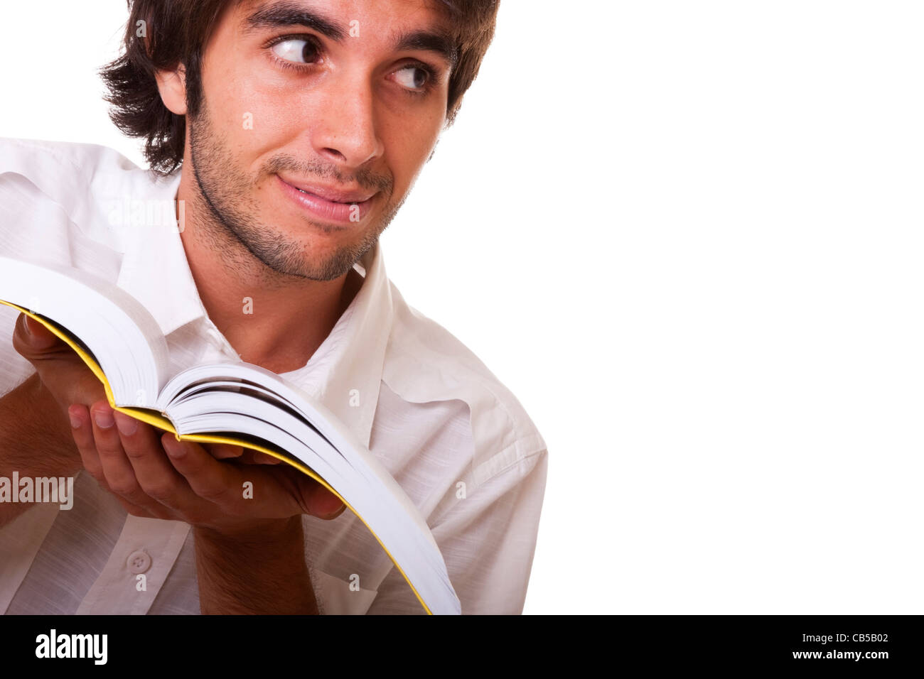 a young man reading a blue book (isolated on white Stock Photo - Alamy