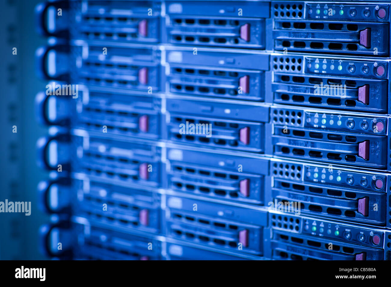Server rack cluster in a data center (shallow DOF; color toned image ...