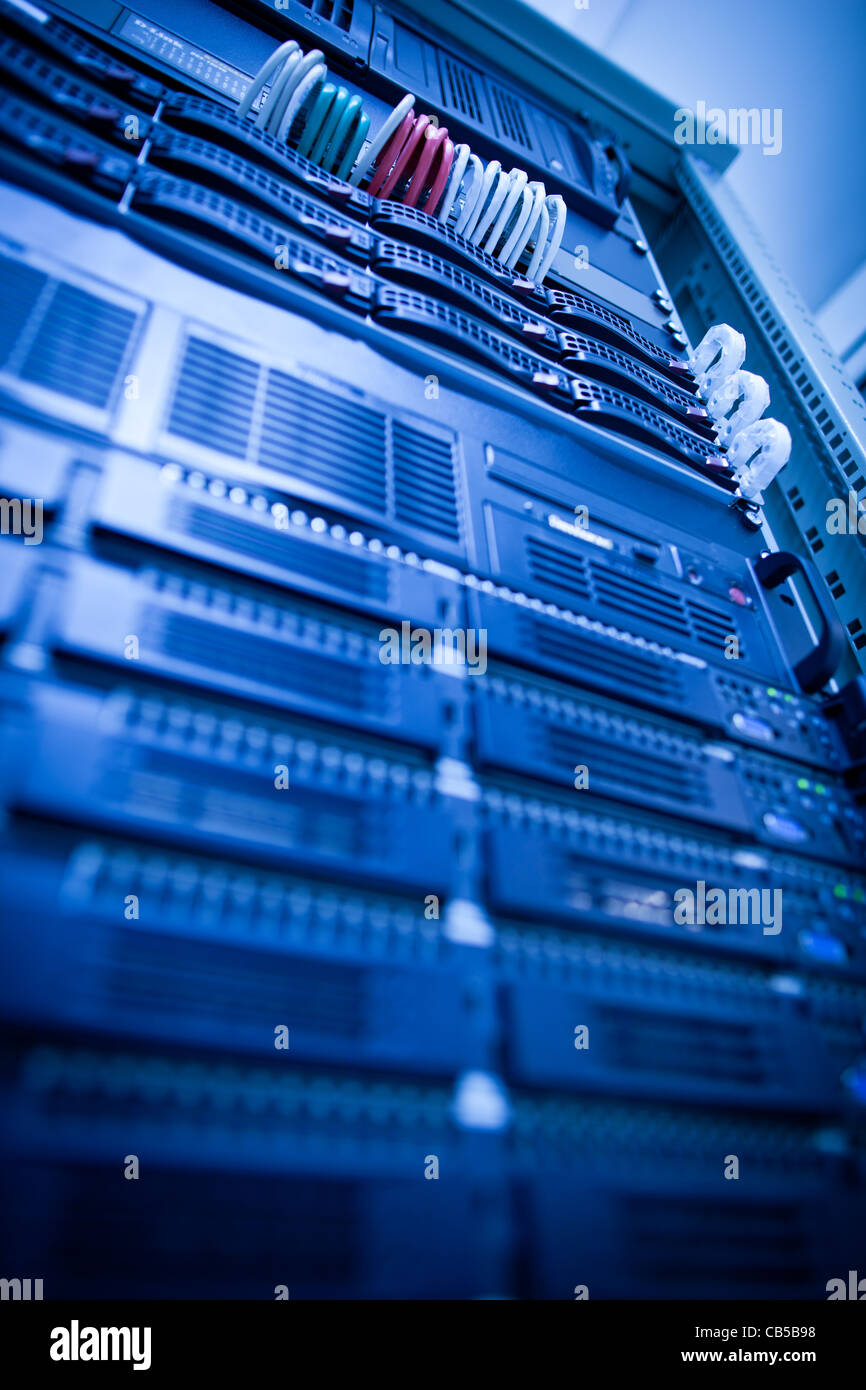 Server rack cluster in a data center (shallow DOF; color toned image ...