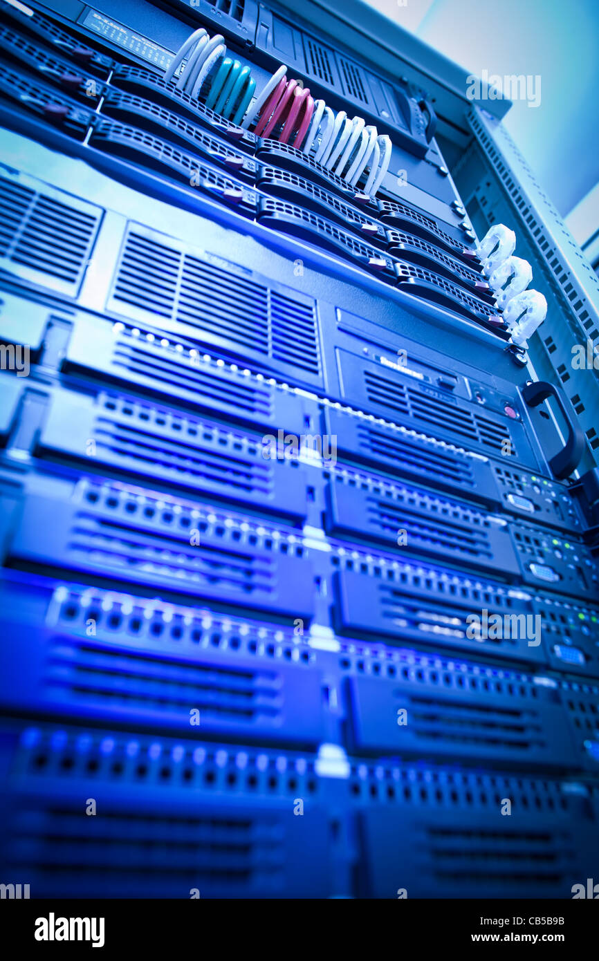 Server rack cluster in a data center (shallow DOF; color toned image ...